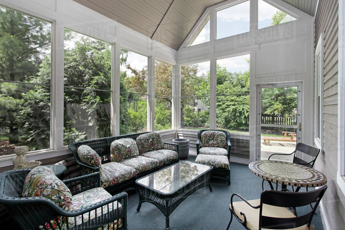 Porch in suburban home with wicker furniture - Royalty-free Stock Photo ...