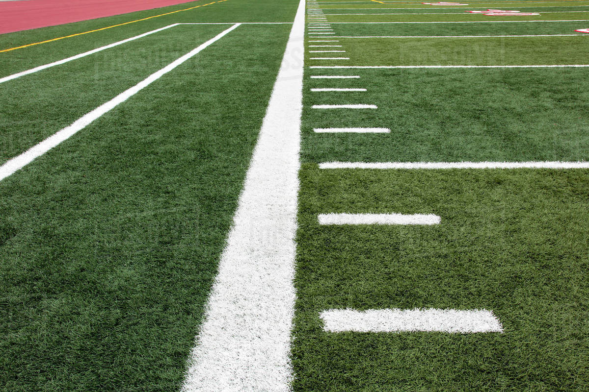 Hash marks on football field near out of bounds line - Stock Photo ...