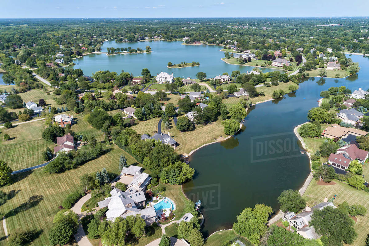 Large community with luxury homes surrounded by lakes in a suburban ...