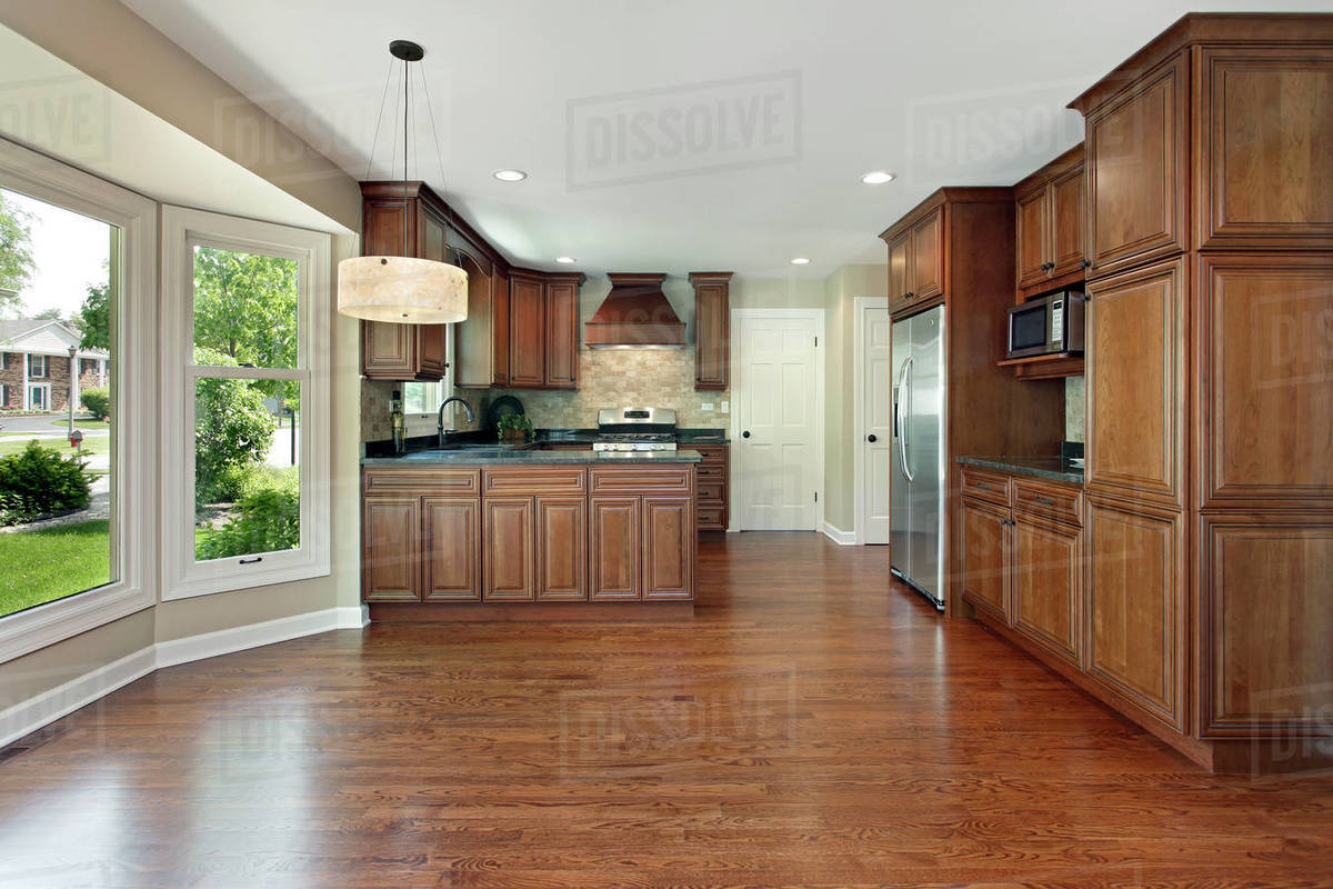 Kitchen in suburban home with oak wood cabinetry - Royalty-free Stock ...