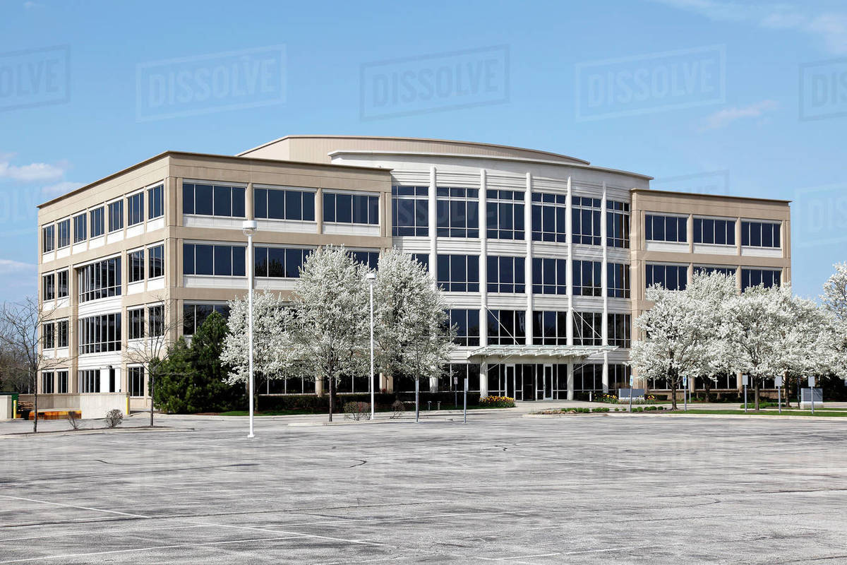 Office building with blooming trees in spring - Royalty-free Stock ...
