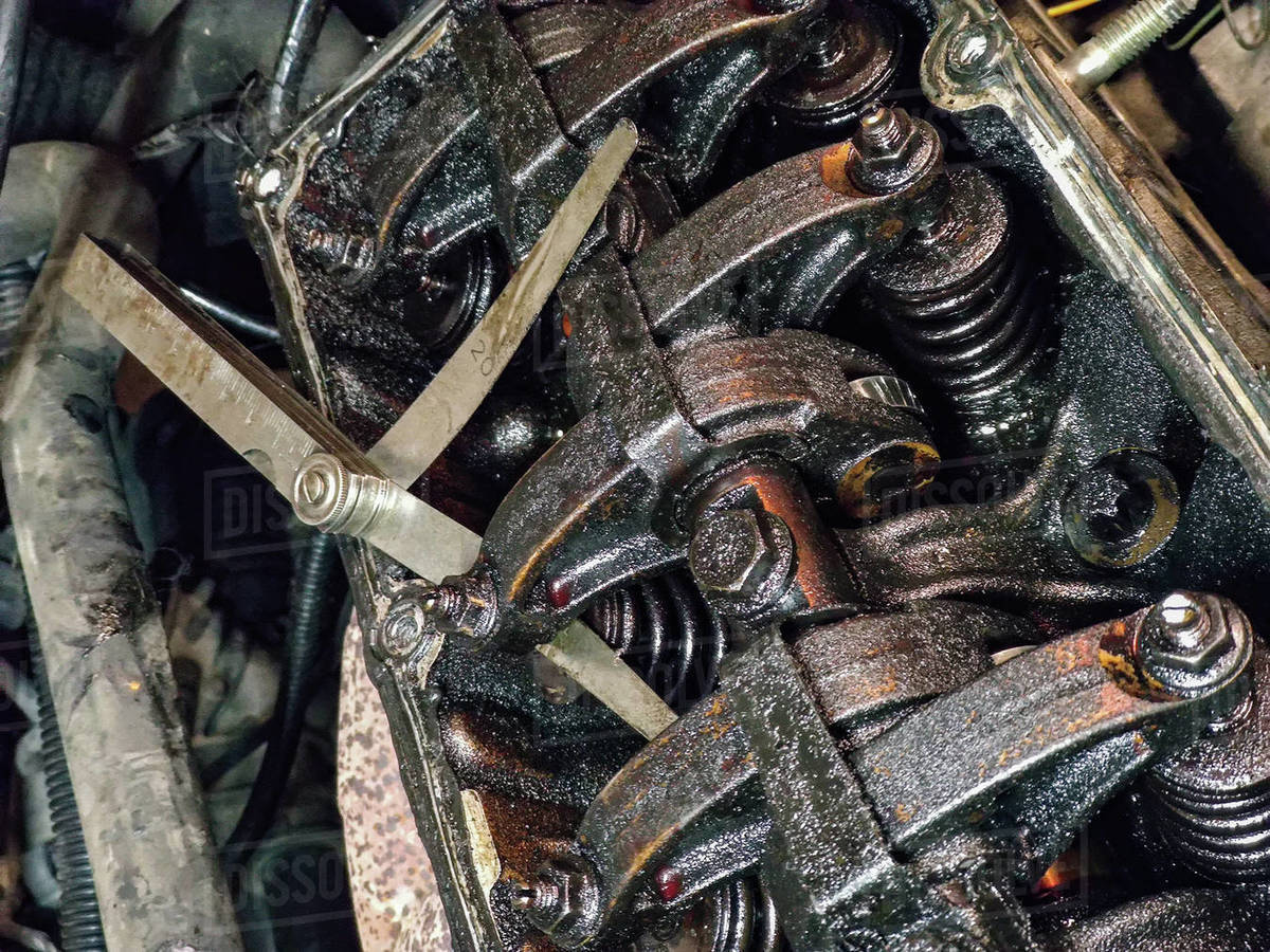 Dirty Valves and engine camshaft inside a broken engine - Royalty-free ...