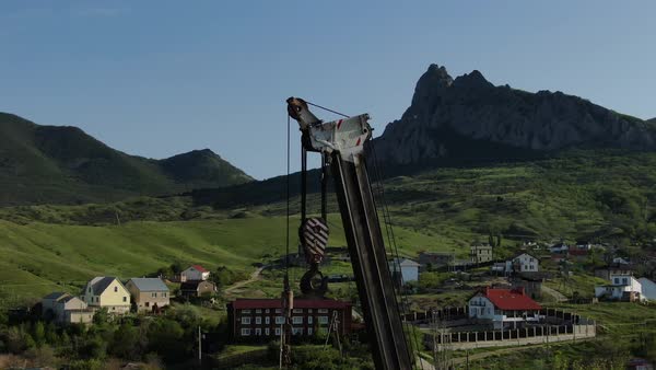 Main boom head of building mobile crane at the background of rural ...