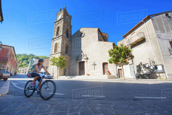 Bicycling through old town of Stio, Cilento, Campania, Southern Italy ...