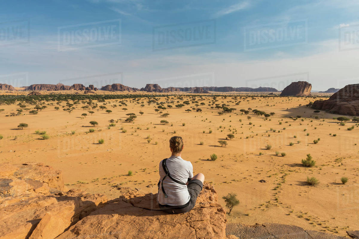 Woman enjoying the beautiful scenery, Ennedi Plateau, UNESCO World ...