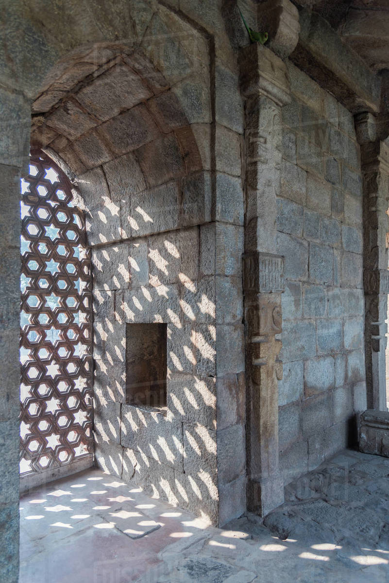 The intricate window carvings provide beautiful shadows at Qutub Minar ...