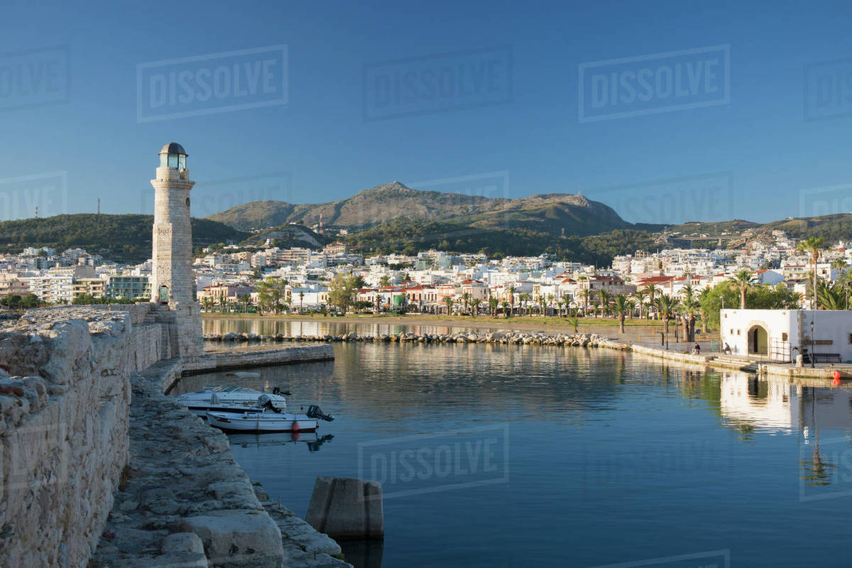 View along sea wall of the Venetian Harbour, 16th century lighthouse ...
