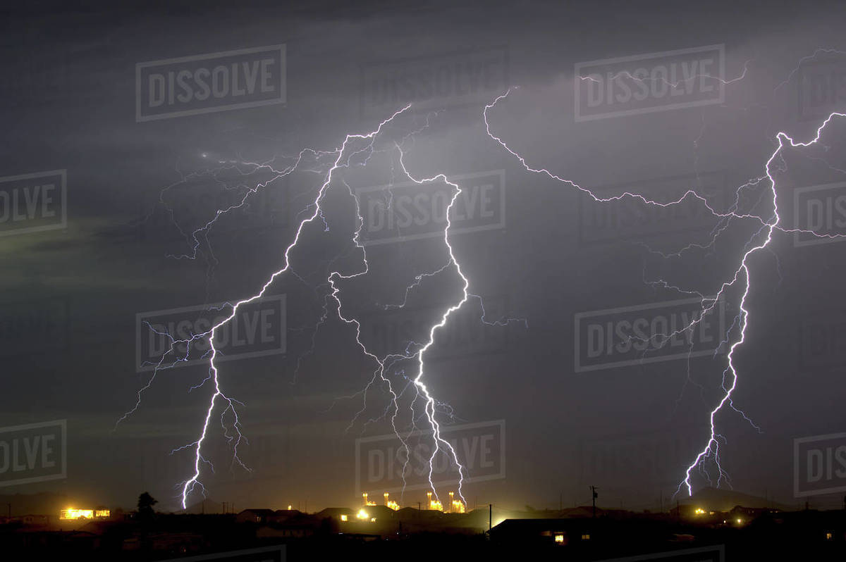 Multiple lightning bolts striking a power plant in Arlington during the ...