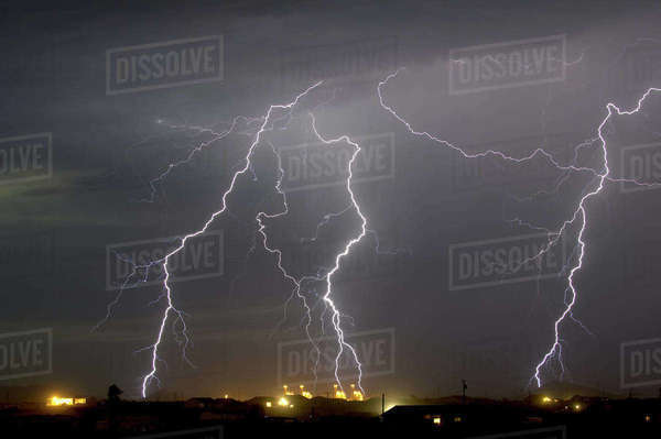 Multiple lightning bolts striking a power plant in Arlington during the ...