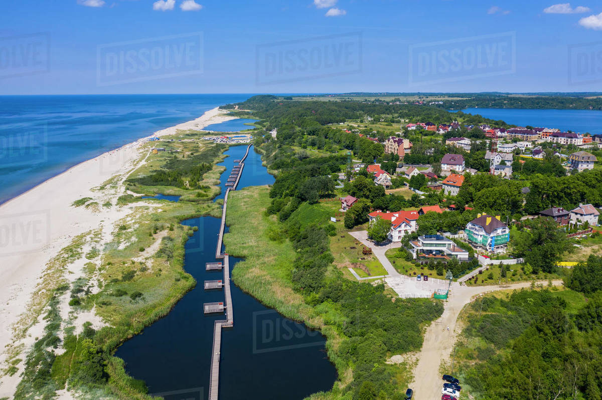 Aerial by drone of a boardwalk in a little lake on the coast of ...
