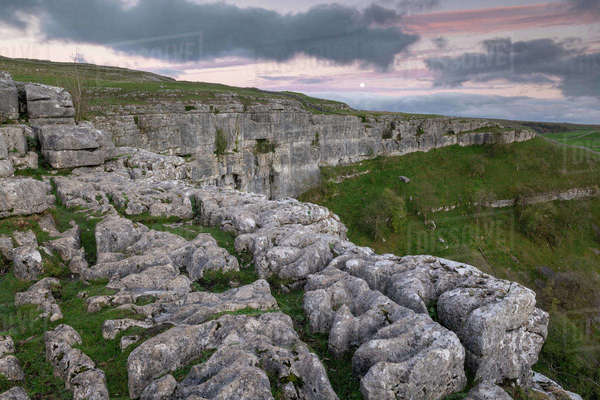 Limestone cliffs above Malham Cove in the Yorkshire Dales National Park ...