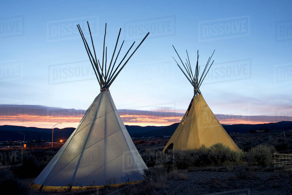 Teepees (tipis) on display at sunset in Taos, New Mexico, United States ...
