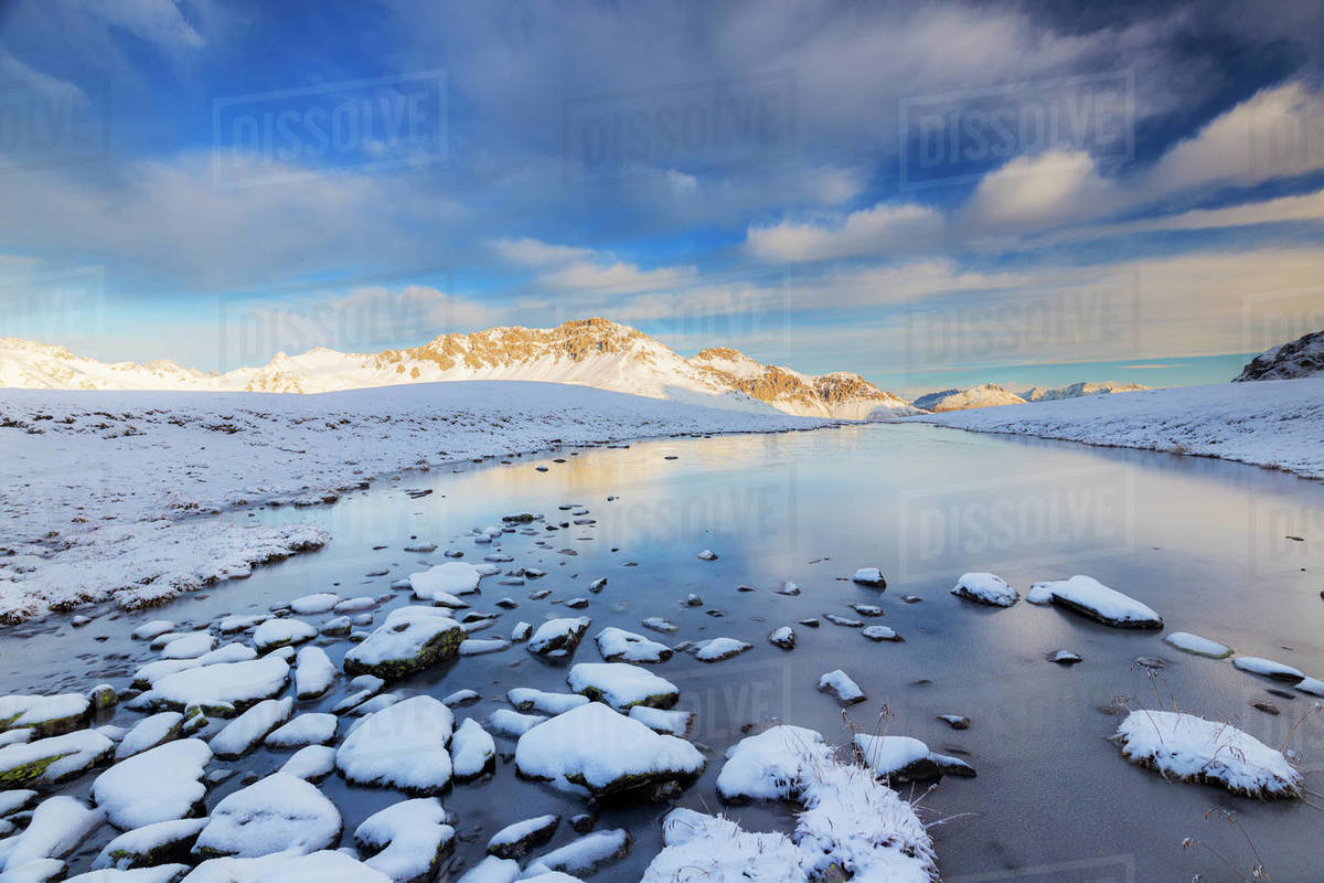 Winter scenery with frozen alpine lake, Stelvio Pass, Valtellina ...
