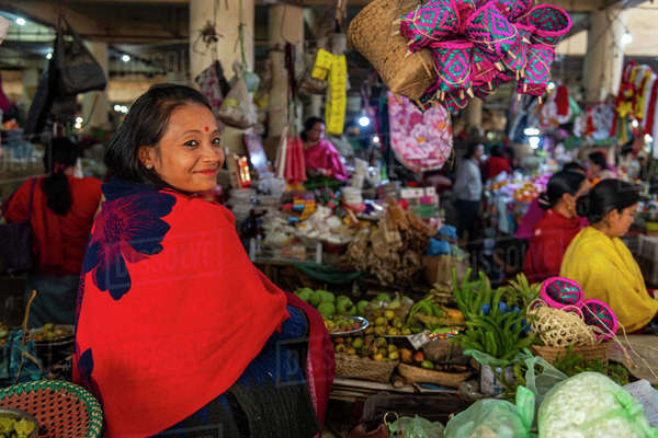 Woman vendor selling colourful dolls, Ima Keithel women's market ...