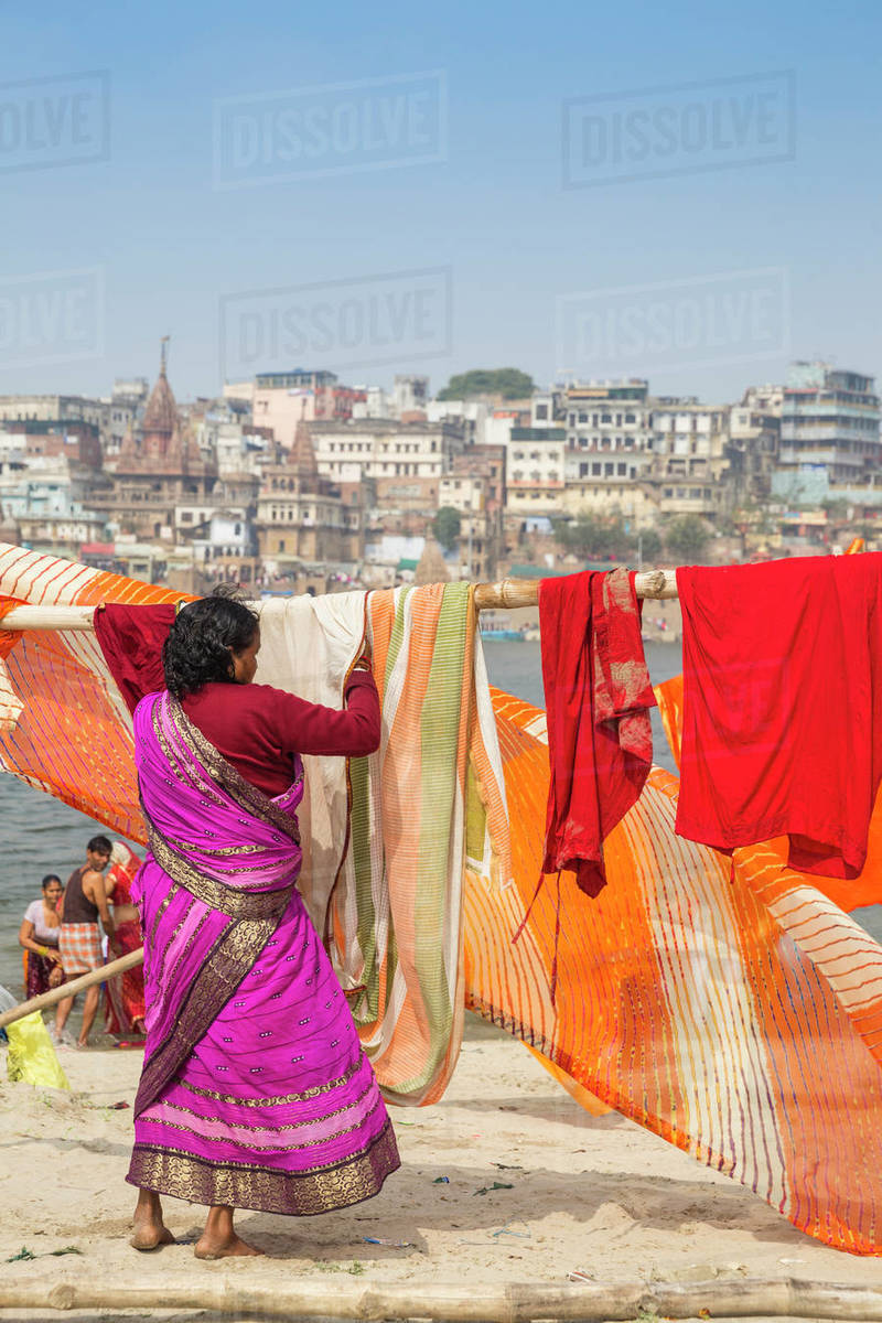 Hanging up washing on banks of Ganges River, Varanasi, Uttar Pradesh ...