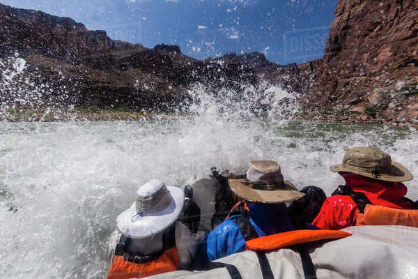 Shooting the rapids in a raft on the Colorado River, Grand Canyon ...