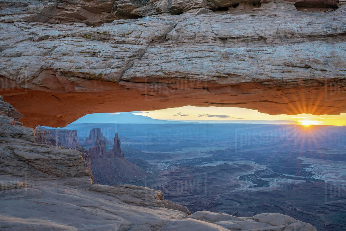 Close up view of canyon through Mesa Arch at sunrise, Canyonlands ...