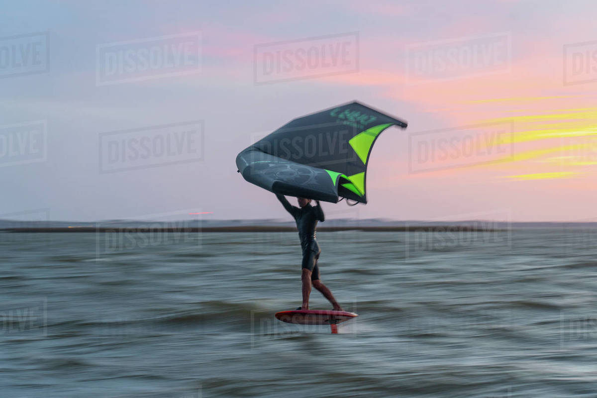 Pro surfer James Jenkins on his wing surfer flies across the Pamlico ...