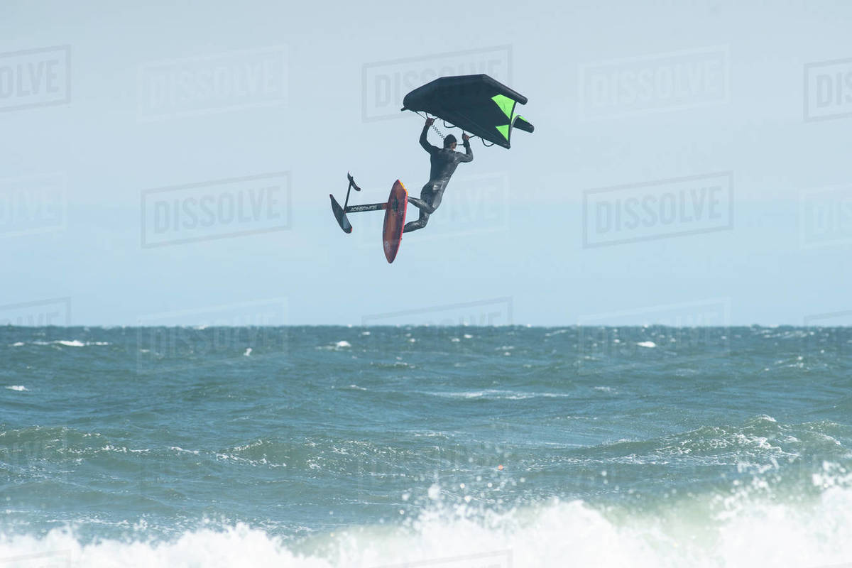 Pro surfer James Jenkins flies above the Atlantic Ocean on his wing ...