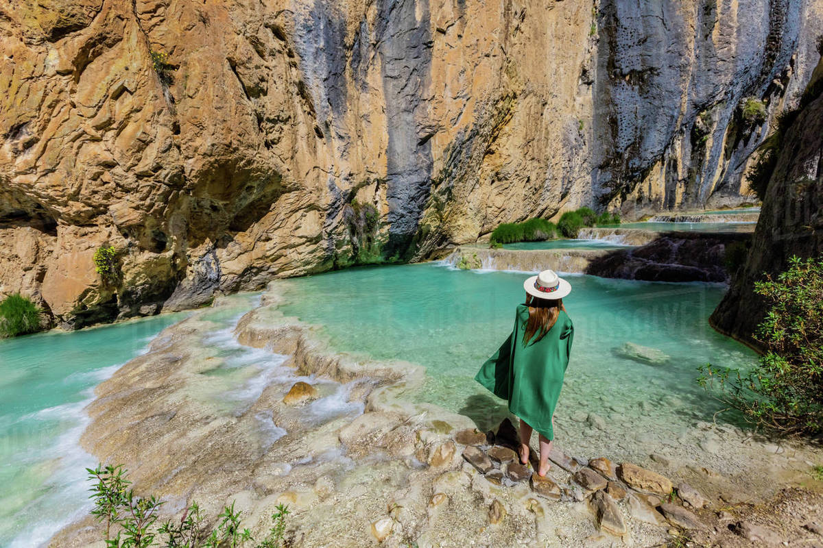 Woman taking in the Millpu Natural Pools, Ayacucho, Peru, South America ...