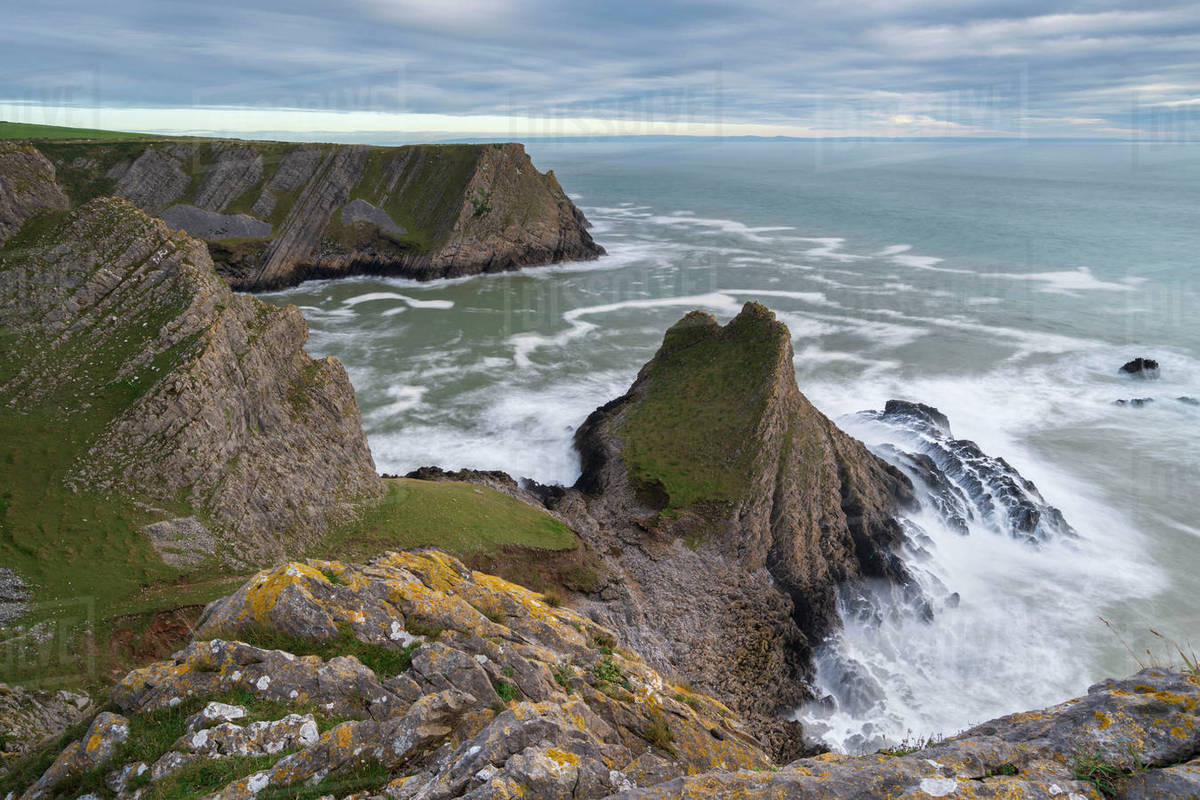 Dramatic cliffs on the Gower Peninsula coast in autumn, Wales, United ...