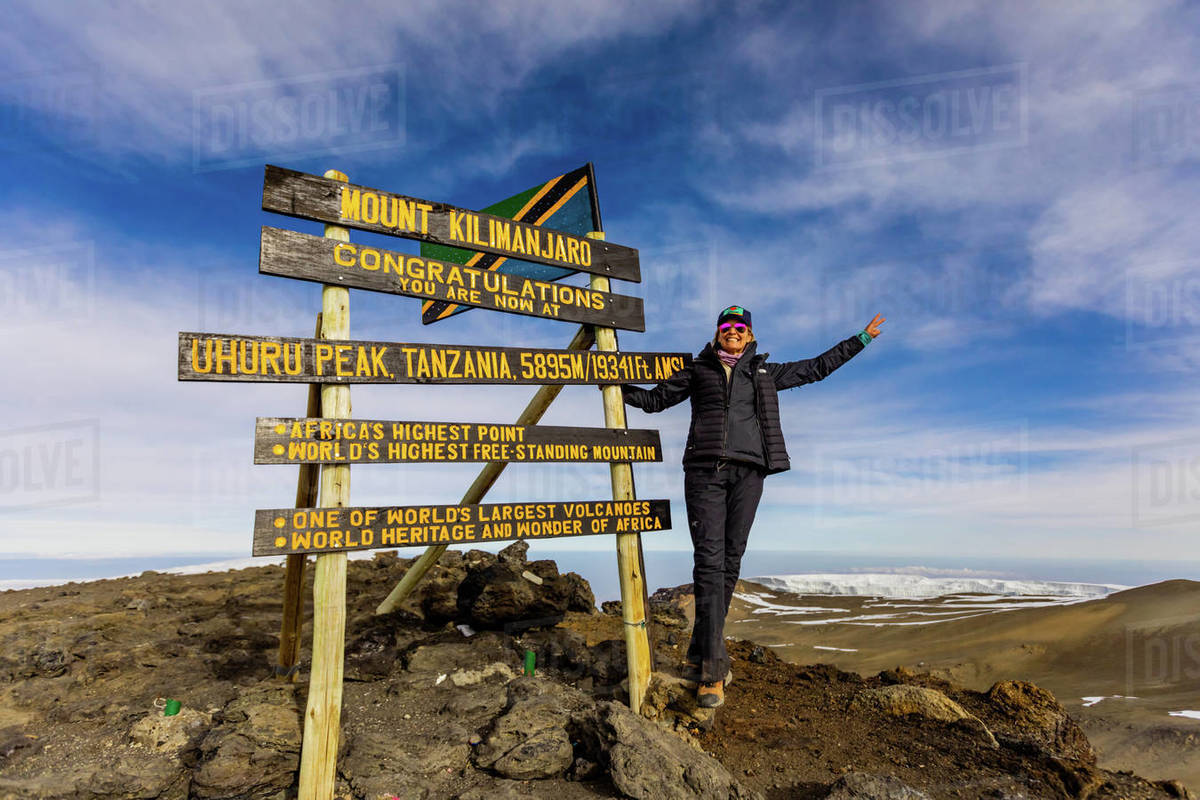 Woman excited she made it to Uhuru Peak on Mount Kilimanjaro, UNESCO ...