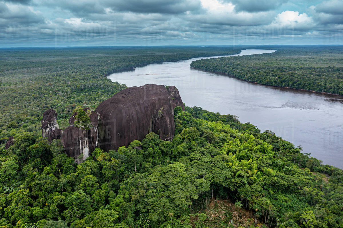 Aerial of the Curimacare Rock on the Casiquiare River in the deep south ...