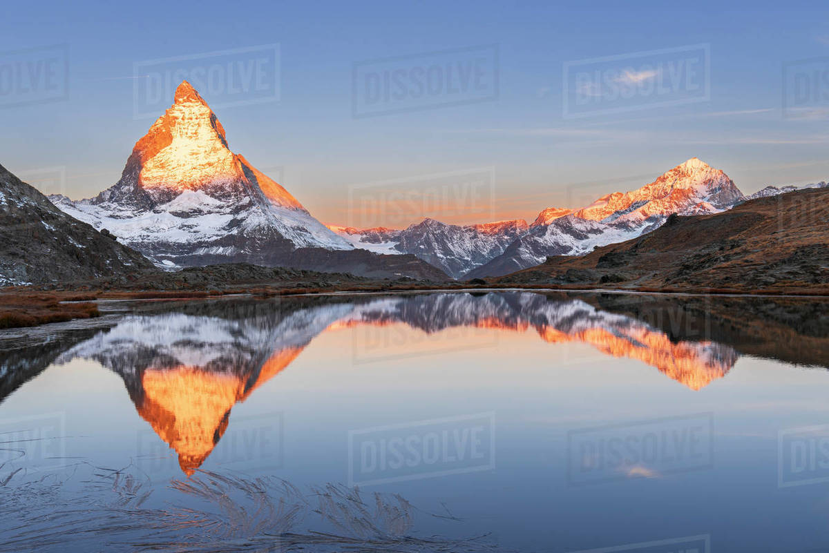 Matterhorn reflection in Riffelsee lake at sunrise, Gornergrat, Zermatt ...