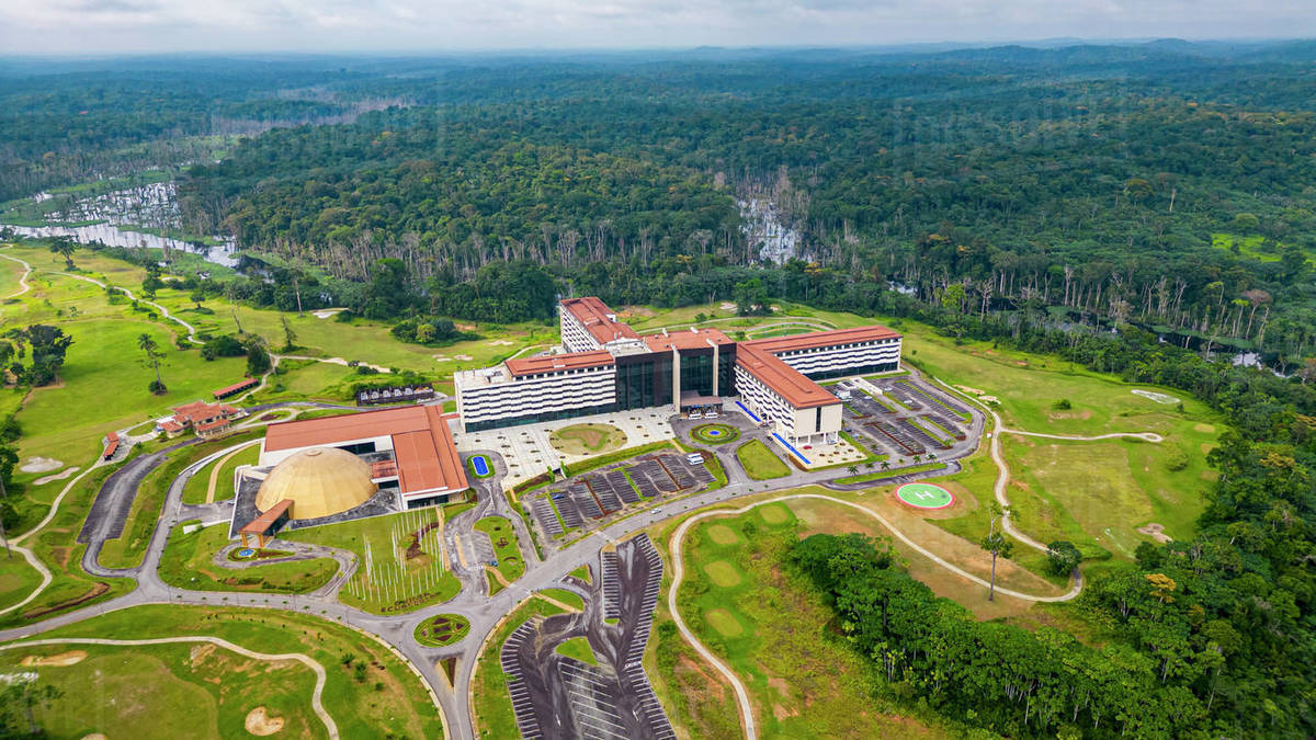 Aerial of the 5 star Djibloho Hotel in the jungle, Ciudad de la Paz ...