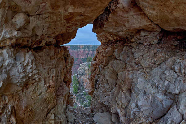 A gap between a stack of balanced boulders on a cliff east of Grandview ...