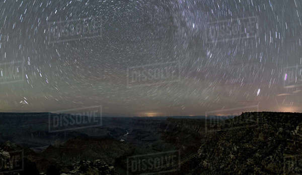 The swirl of stars in the night sky over Grand Canyon South Rim viewed ...