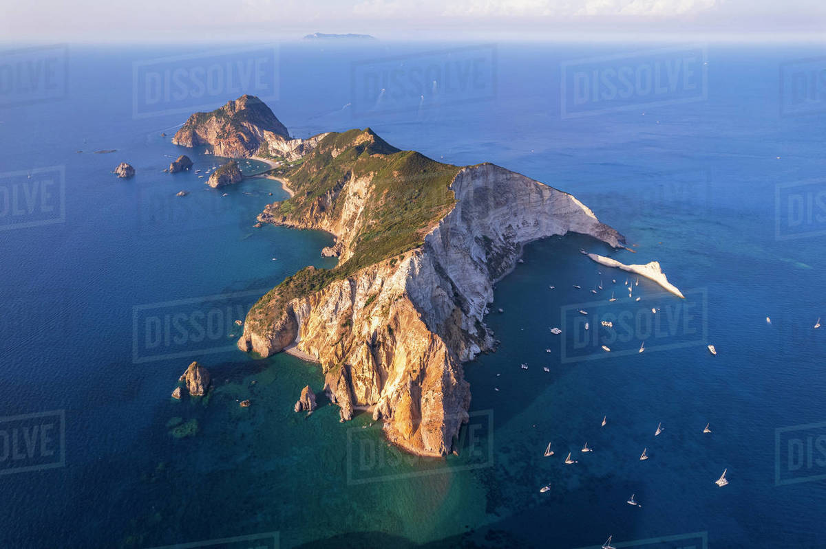 Aerial view of the island of Palmarola, with boats anchored in the blue ...
