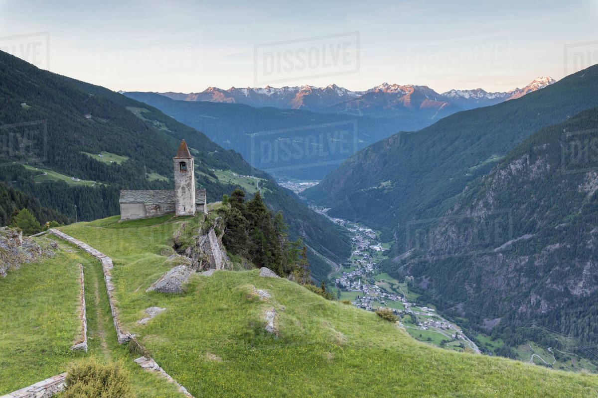 Ancient church at sunrise, San Romerio Alp, Brusio, Canton of ...