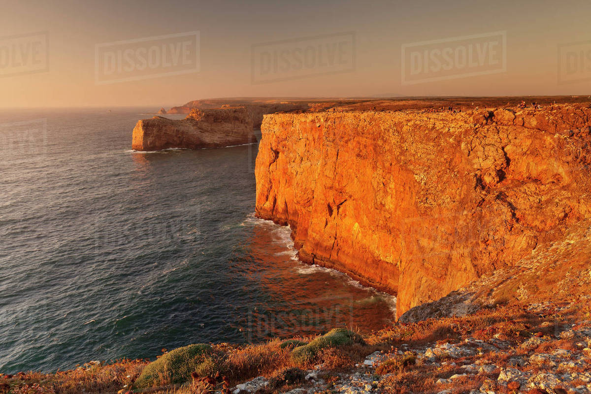 Cliff coast at sunset, Cabo de Sao Vicente, Sagres, Algarve, Portugal ...