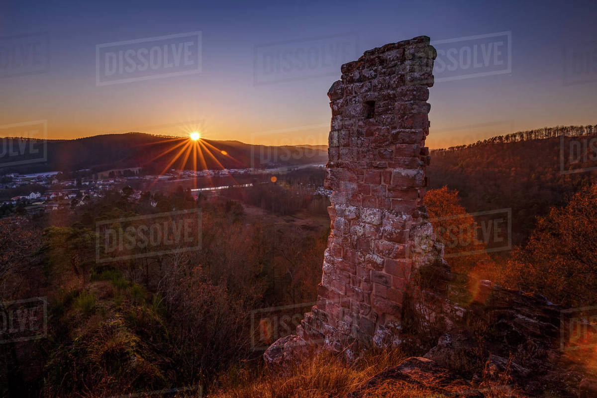 Sunset over the Chateau de Ramstein, a ruined castle in the commune of ...