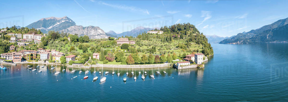 Panoramic aerial view of sailboats in Lake Como around the village of ...