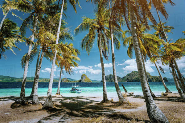 Ipil beach in front of unique Pinagbuyatan Island with huge limestone ...