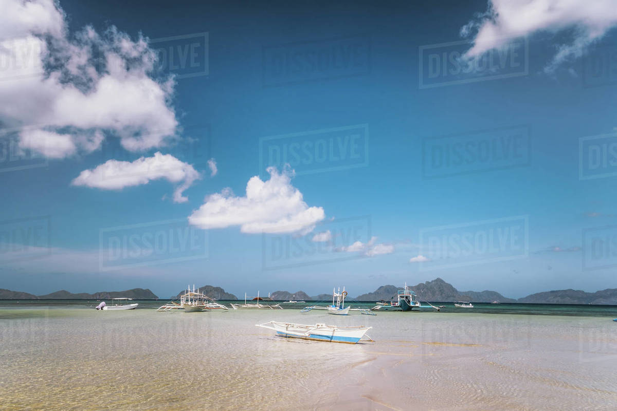 A traditional Filipino boat on an empty sandy bar. - Royalty-free Stock ...
