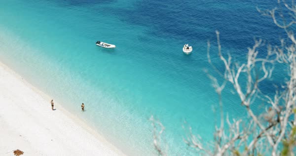 Tourists enjoying secluded Fteri Beach on Keflaonia Island, Greece - 4K ...