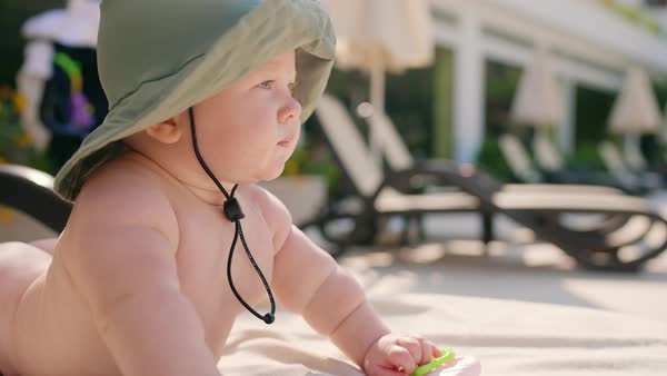 Cute baby having family rest on beach spa resort. Toddler lie near ...