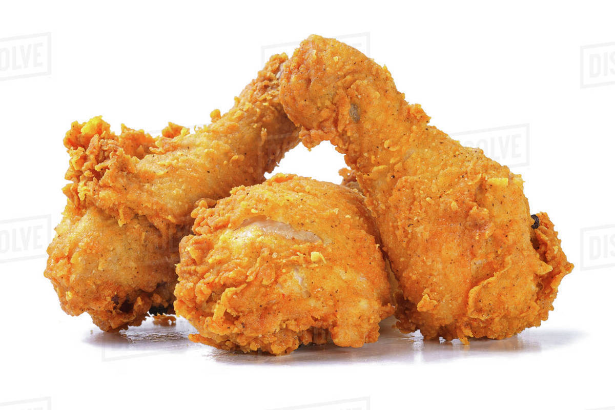Photo of yellow fried chicken legs on white background - Stock Photo ...
