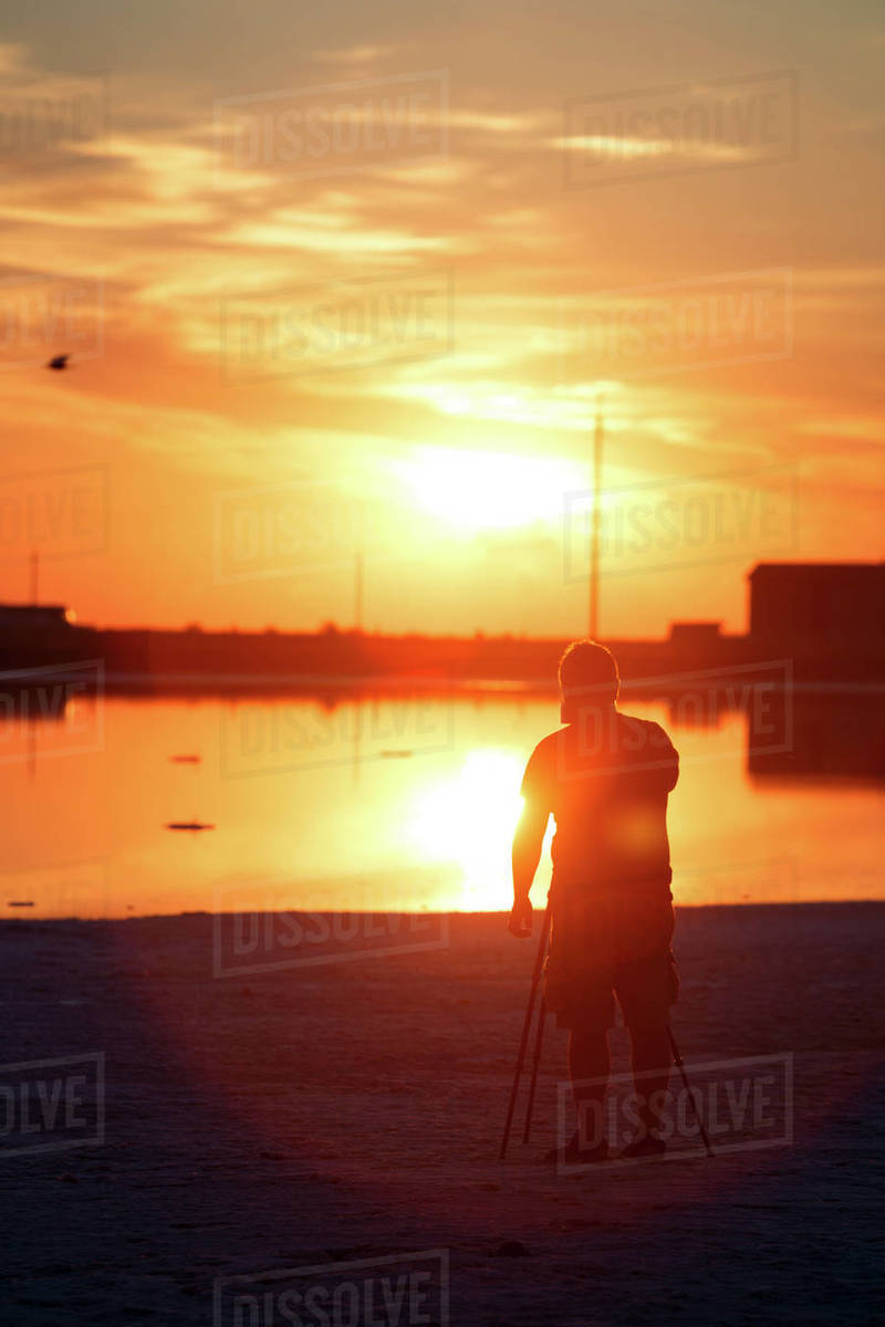 Male photographer shoots a beautiful sunset - Royalty-free Stock Photo ...