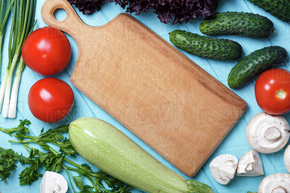 Healthy eating. fresh vegetables on a blue wooden background. zucchini ...