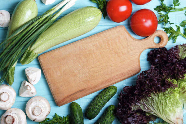 Healthy eating. fresh vegetables on a blue wooden background. zucchini ...