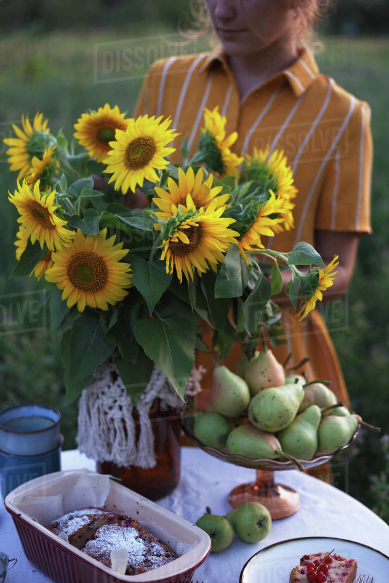 Garden and still life. tea party in the garden - girl and bouquet with ...