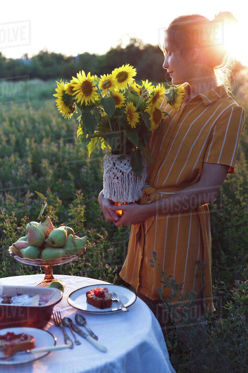 Garden and still life. tea party in the garden - girl and bouquet with ...