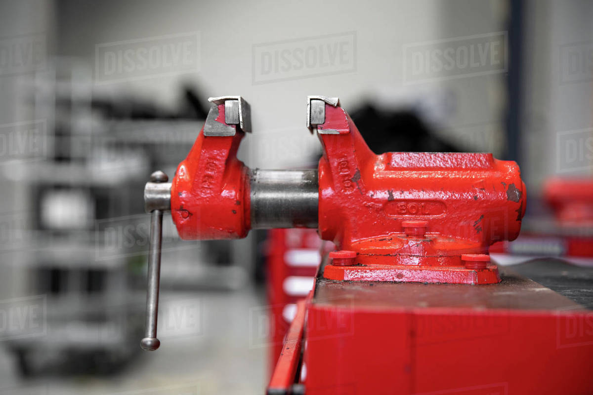 red vise on table in factory. - Stock Photo - Dissolve
