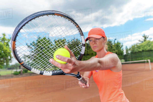 A tennis racket in the hand of a young tennis player - Stock Photo ...