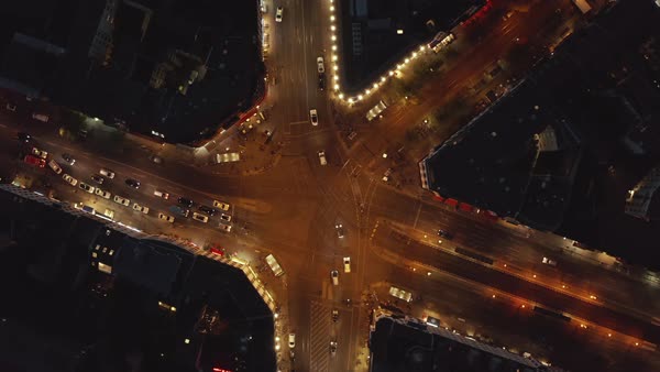 AERIAL: Birdsview of big intersection traffic at night in Berlin ...