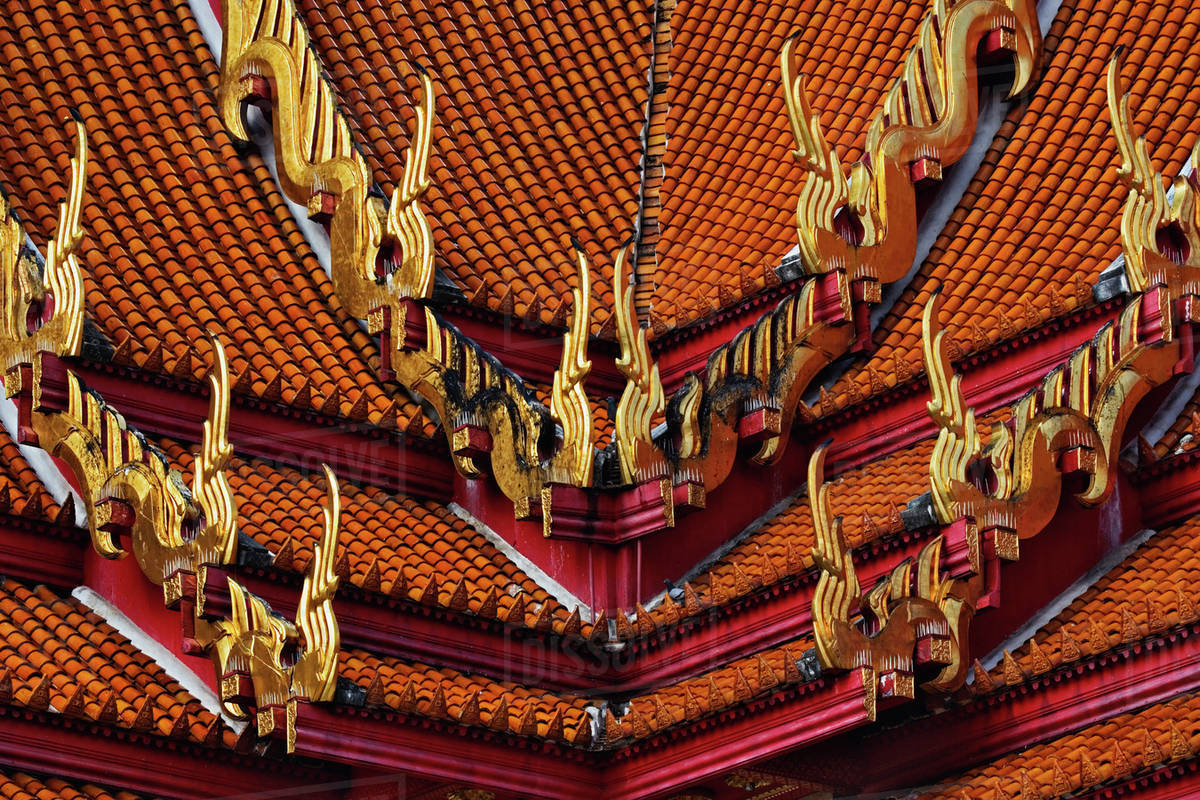 Ornate rooftop architecture of the Ordination Hall (Ubosot Hall) at Wat ...